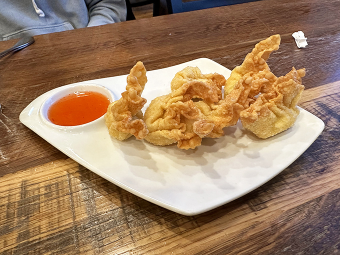 Crispy perfection meets sweet-spicy dipping sauce. These crab rangoon are the unsung heroes of any Thai restaurant appetizer selection.