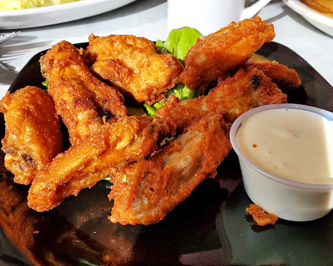 These aren't just wings&mdash;they're crispy golden tickets to flavor town. That dipping sauce is standing by for its supporting role.