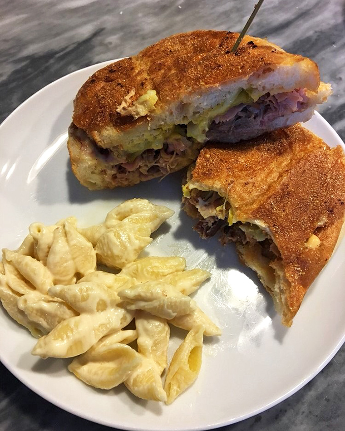 The Cuban sandwich with pasta side proves that diplomatic relations between countries can be deliciously maintained on a single plate.