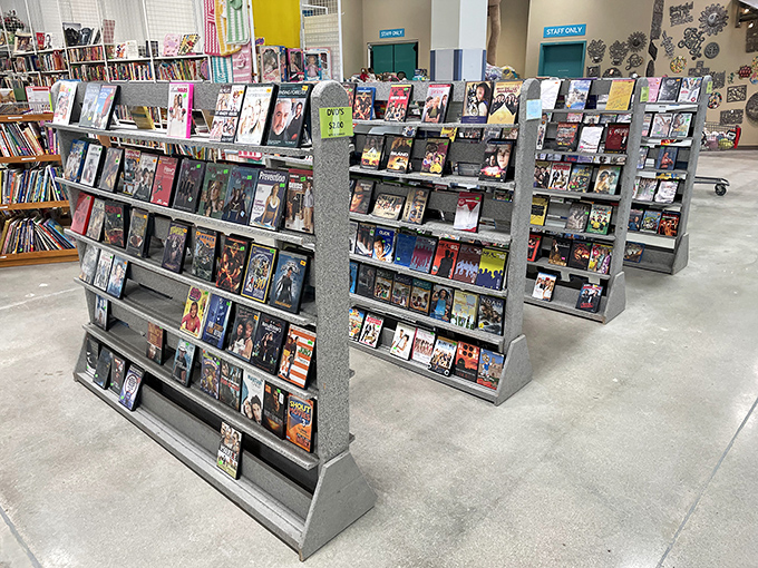 The DVD section stands as a physical Netflix of yesteryear, where forgotten films and TV series await rediscovery by nostalgic browsers.