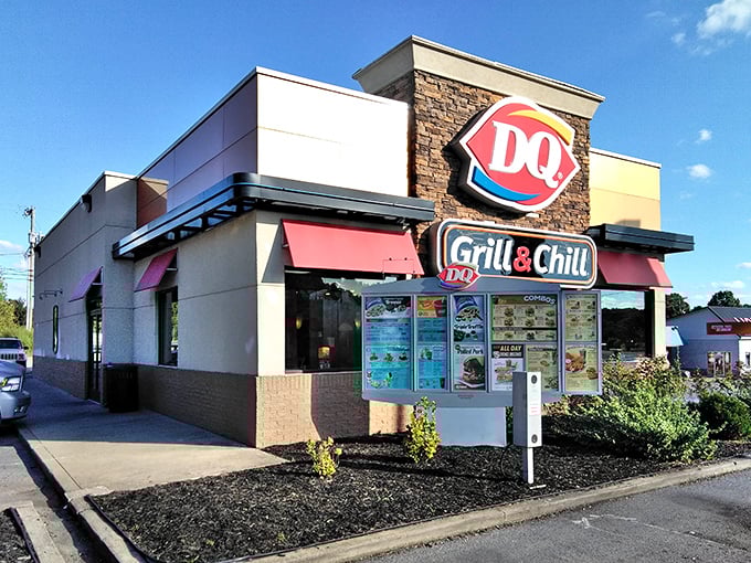 The Dairy Queen sign glows like a beacon for weary hikers, promising the universal language of soft-serve as your reward for conquering nature.