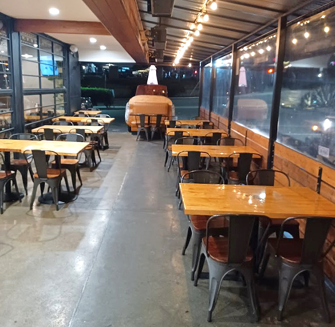 The covered patio – where string lights twinkle above tables that have witnessed countless "this is the best barbecue I've ever had" declarations.