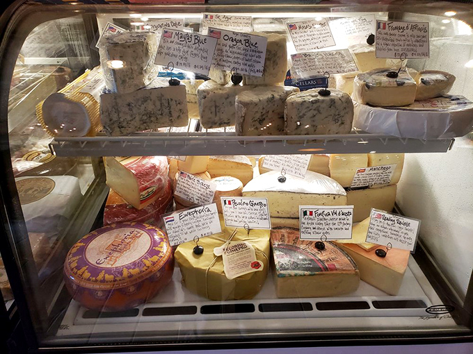 A cheese case that inspires both poetry and hunger—each wedge and wheel telling stories of craftsmanship and patience.