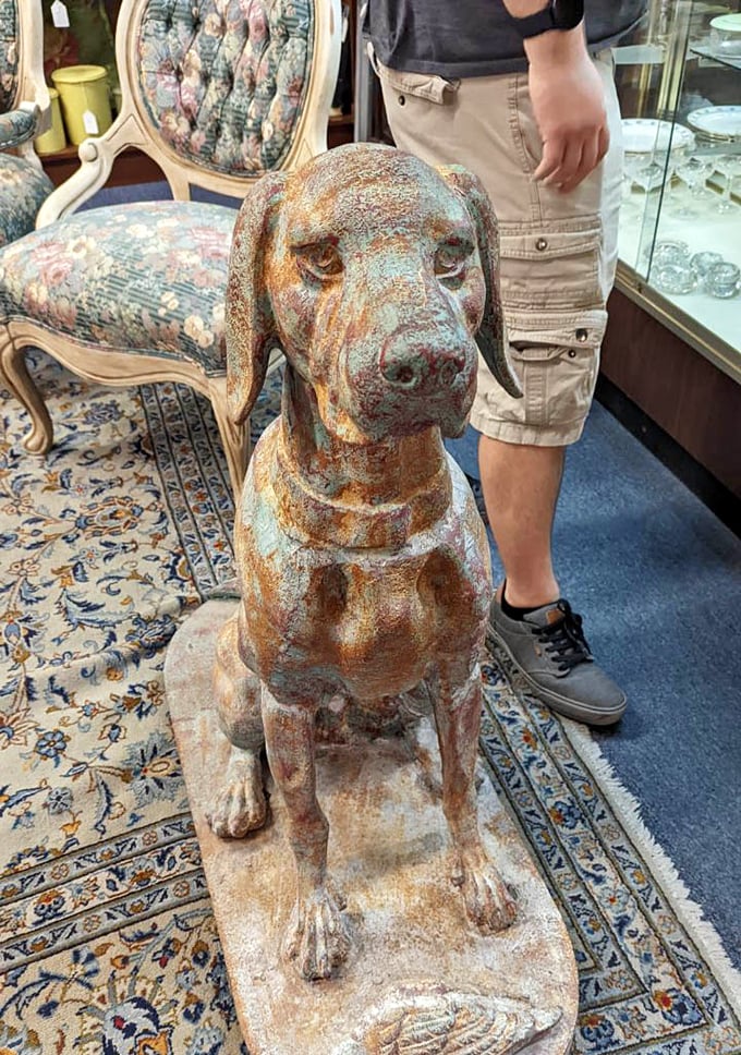 This weathered metal dog statue has the dignified look of a good boy who's seen decades come and go, waiting for the right owner.