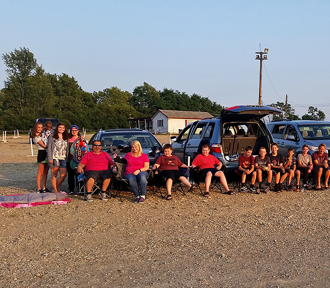 The ultimate family outing where multiple generations gather on blankets and chairs, creating memories that outlast any movie plot.