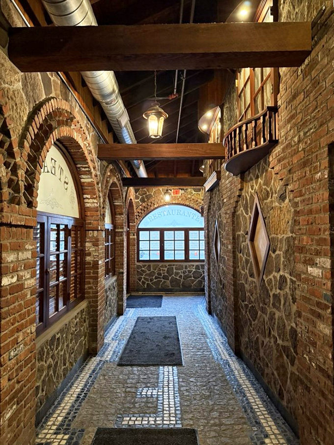 This entrance corridor isn't just a hallway—it's a dramatic introduction. The brick archways and stone walls whisper, "Prepare your appetite for something extraordinary."