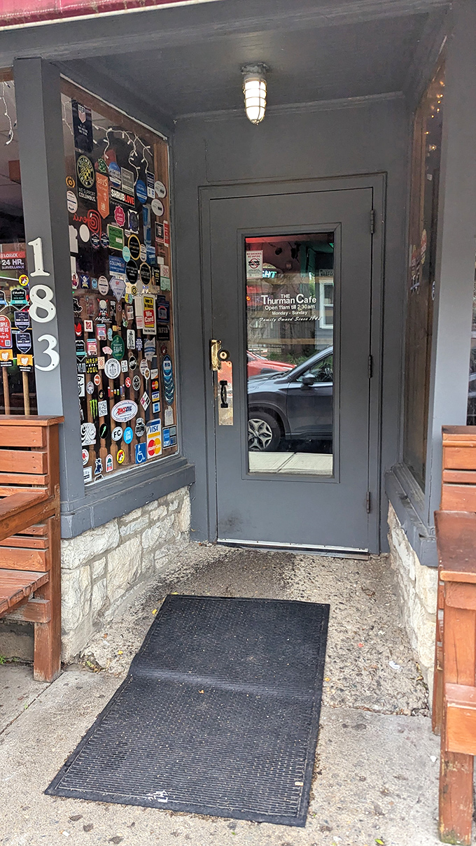 The door to burger paradise, complete with a wall of stickers documenting pilgrimages past. Cross this threshold and abandon all diet plans, ye who enter here.