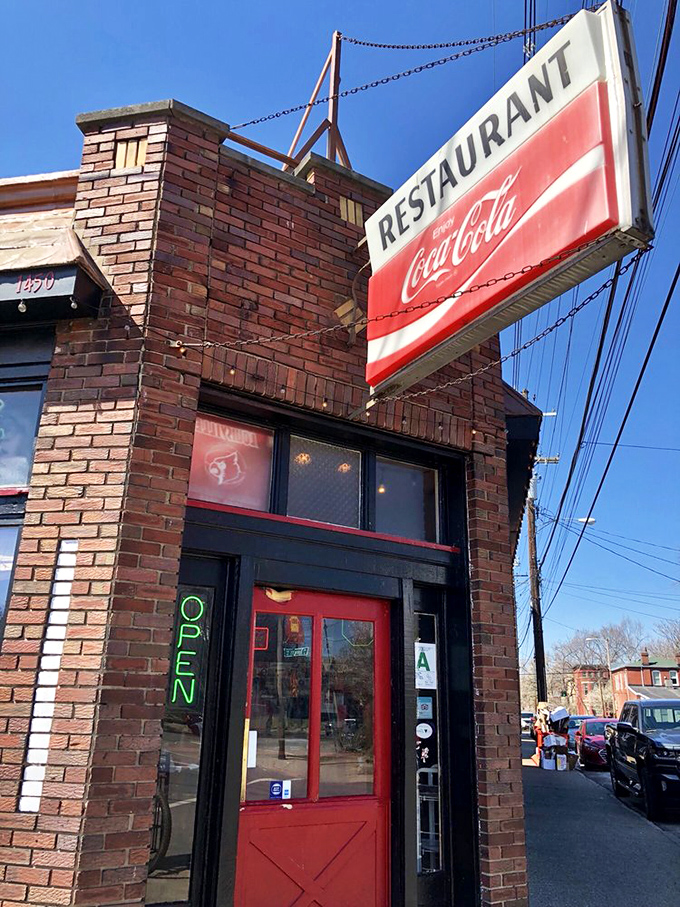 That vintage Coca-Cola sign has watched over countless satisfied customers, like a delicious guardian angel of burgers.