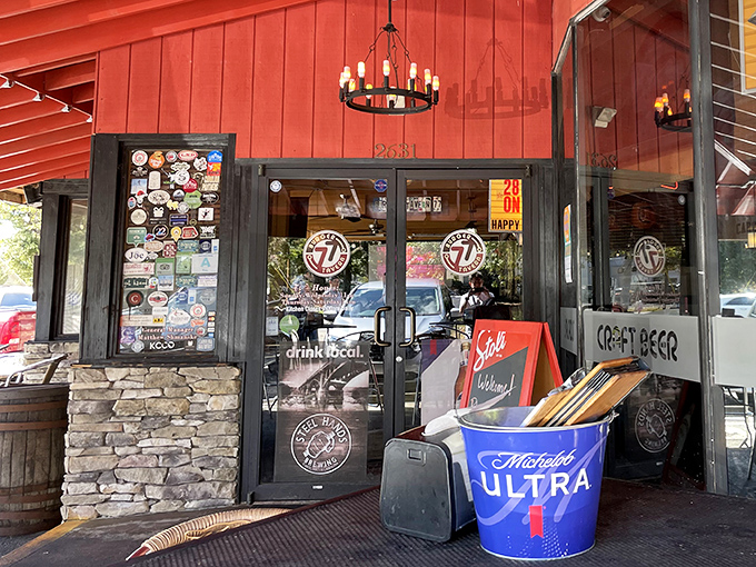 The entrance, adorned with stickers and signage, serves as a preview of the personality waiting inside&mdash;unpretentious, fun, and proudly local.