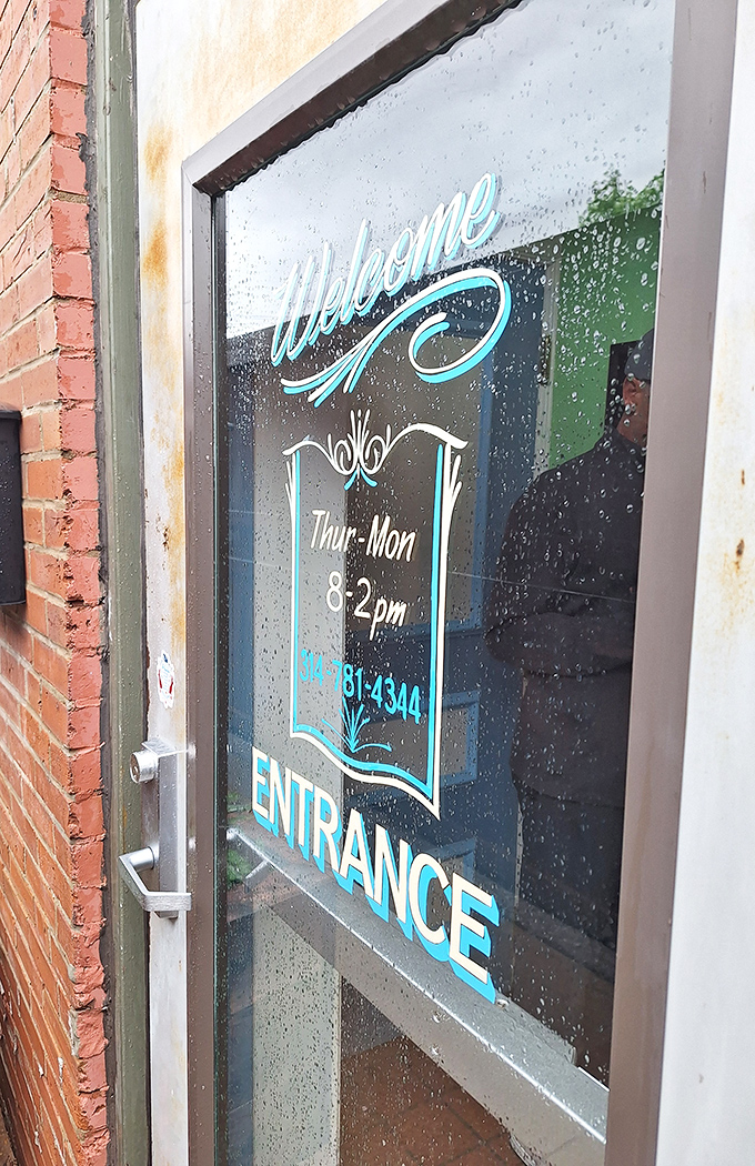 "Welcome" indeed—these blue-lettered hours are your gateway to breakfast bliss. Thursday through Monday, 8am-2pm, mark your calendars accordingly.