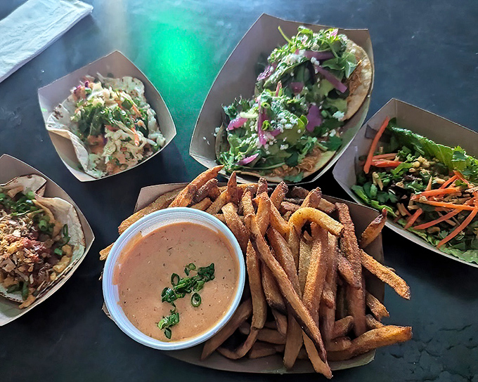 A spread that says "indecision welcomed here"—where tacos, fries, and fresh veggies create a choose-your-own-adventure of flavors on one table.