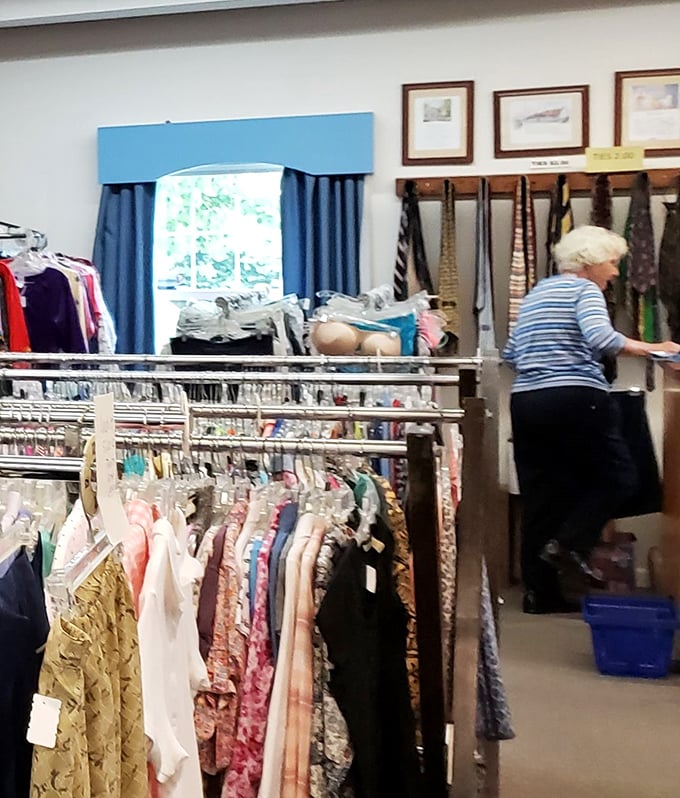 The seasoned thrifter at work, methodically checking each item with the precision of a surgeon and the patience of a saint. This isn't her first rodeo.