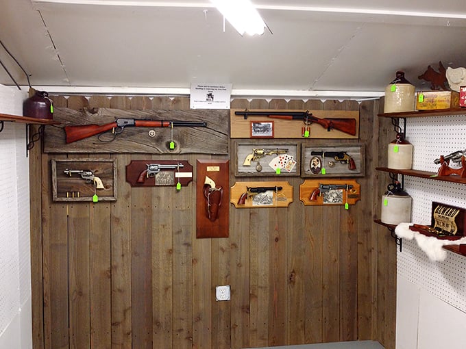The firearms display showcases pieces from when the West was won with craftsmanship and wood grain.