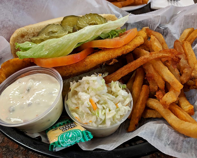 A proper diner basket: crispy fish sandwich, hand-cut fries, and coleslaw&mdash;the holy trinity of lunch counter satisfaction.