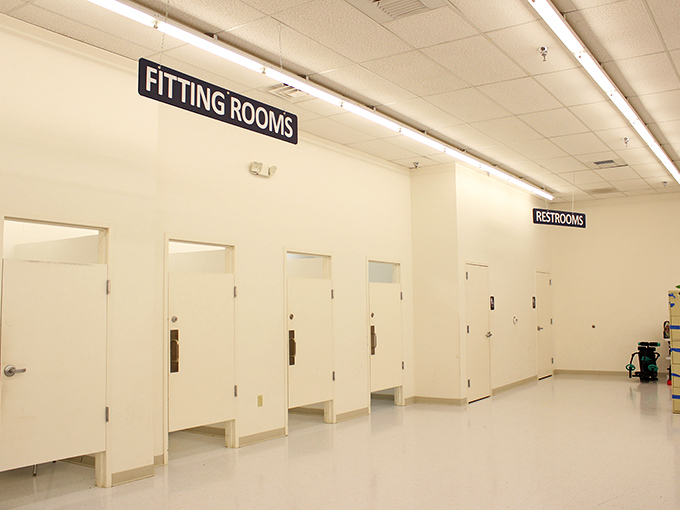 Fitting rooms cleaner than most high-end department stores. The ultimate moment of truth awaits behind those pristine white doors.