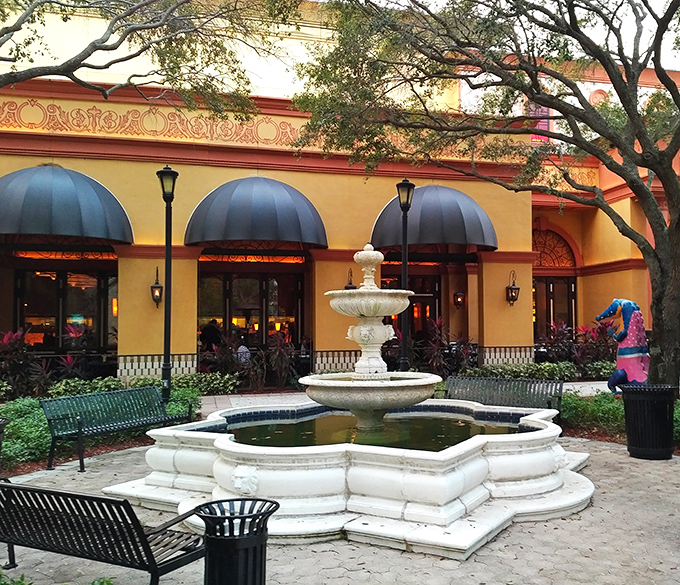 A courtyard fountain provides the soothing soundtrack to retail therapy, inviting moments of contemplation between credit card swipes.
