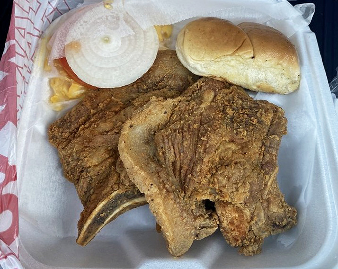 A pork chop sandwich that means business &ndash; hearty, hand-breaded, and served with all the fixings. This isn't lunch; it's an Alabama institution on a bun.