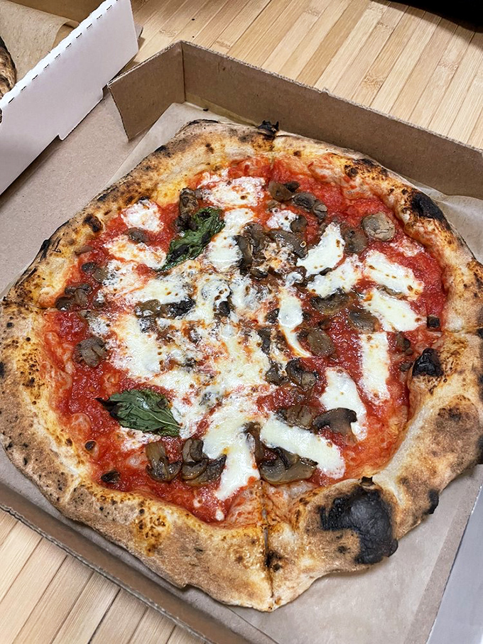 The Funghi Pizza proves that mushrooms aren't just for foraging hipsters&mdash;they're the umami bombs that make this pie unforgettable.