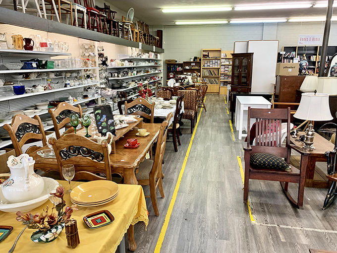 Dining sets and chairs create an impromptu furniture showroom. Each piece whispering possibilities of family dinners and coffee conversations to come.