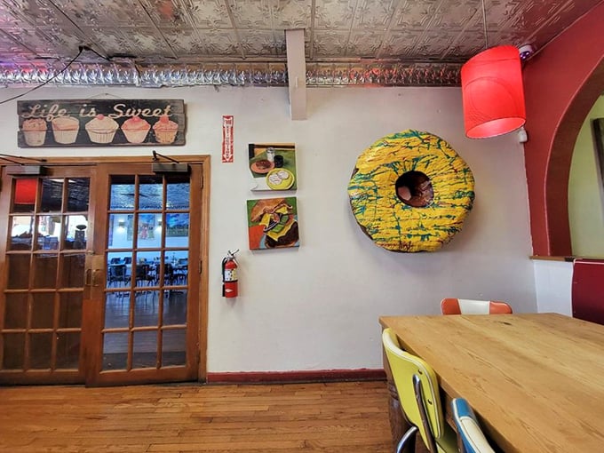 That giant yellow donut sculpture on the wall reminds everyone that life's too short for boring decorating choices.