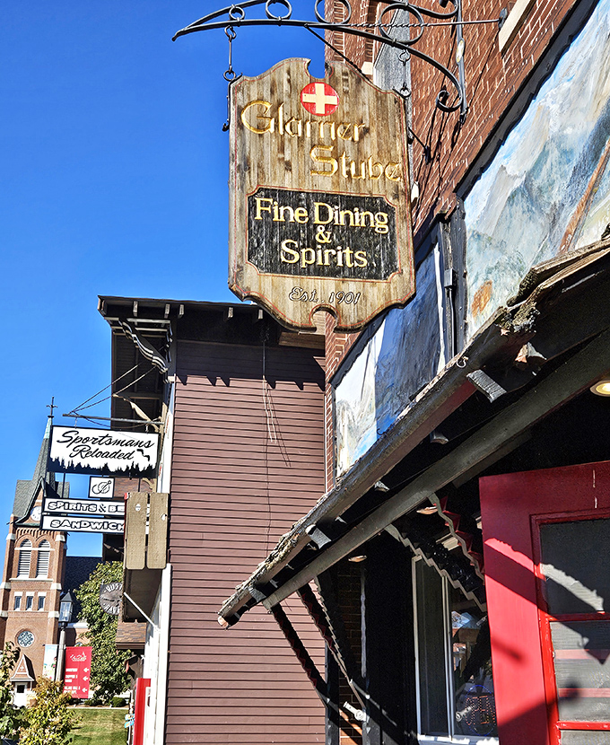 The Glarner Stube's weathered wooden sign promises "Fine Dining & Spirits" with authentic Swiss hospitality. Your taste buds are about to take a European vacation.