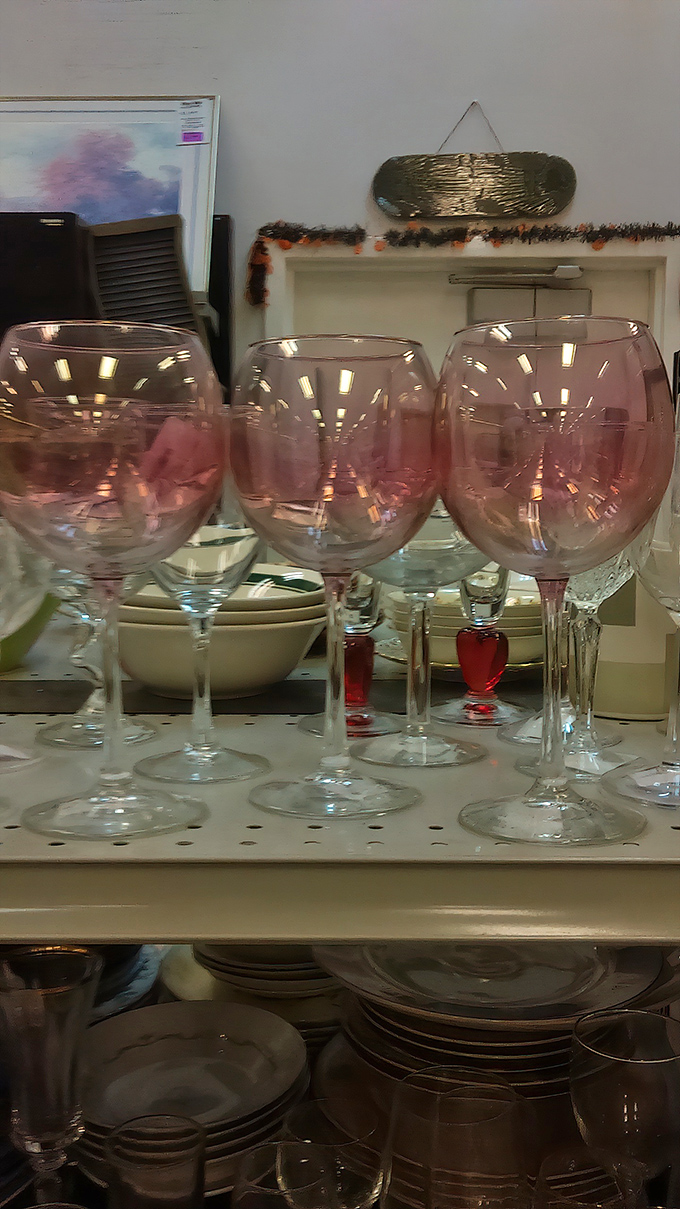 Blush-tinted wine glasses whisper of future dinner parties where guests will marvel at your decorating genius.