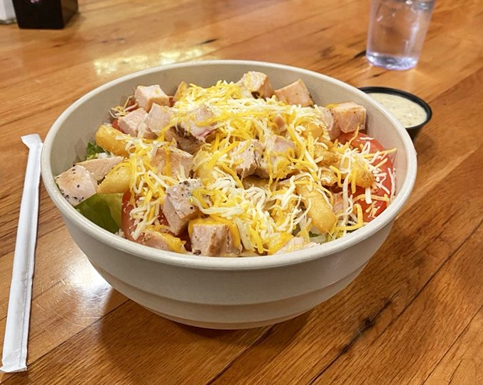 A salad that doesn't apologize for being hearty. Grilled chicken and cheese prove that "eating light" is open to interpretation.