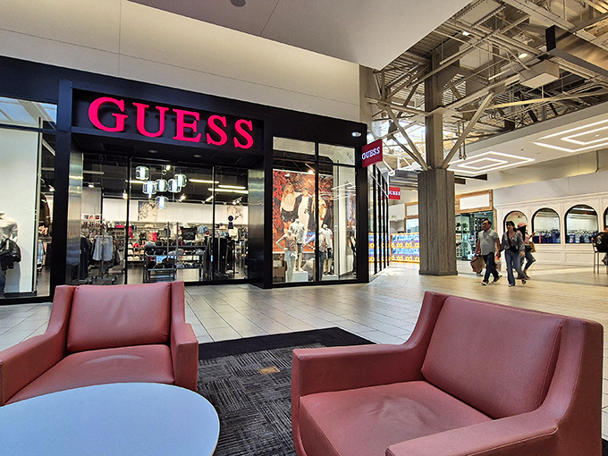 The iconic Guess store with its bold signage and comfortable waiting area&mdash;because shopping companions deserve a comfortable place to rest.