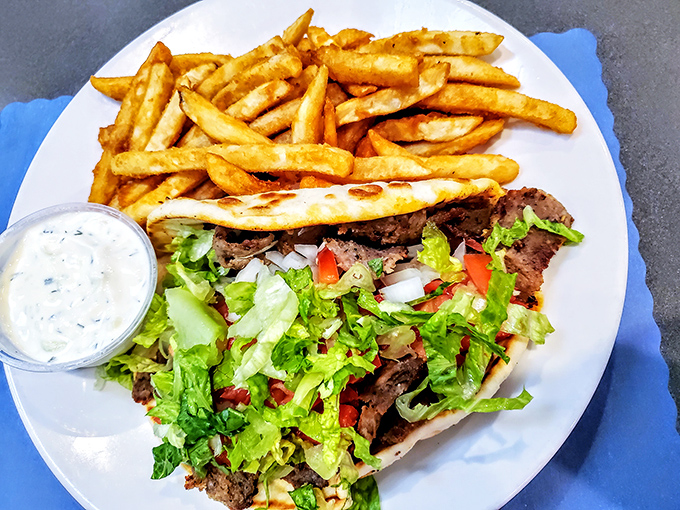 The gyro plate&mdash;where Mediterranean meets American diner culture in perfect harmony. Crispy fries, cool tzatziki, and seasoned meat create a trifecta of satisfaction.