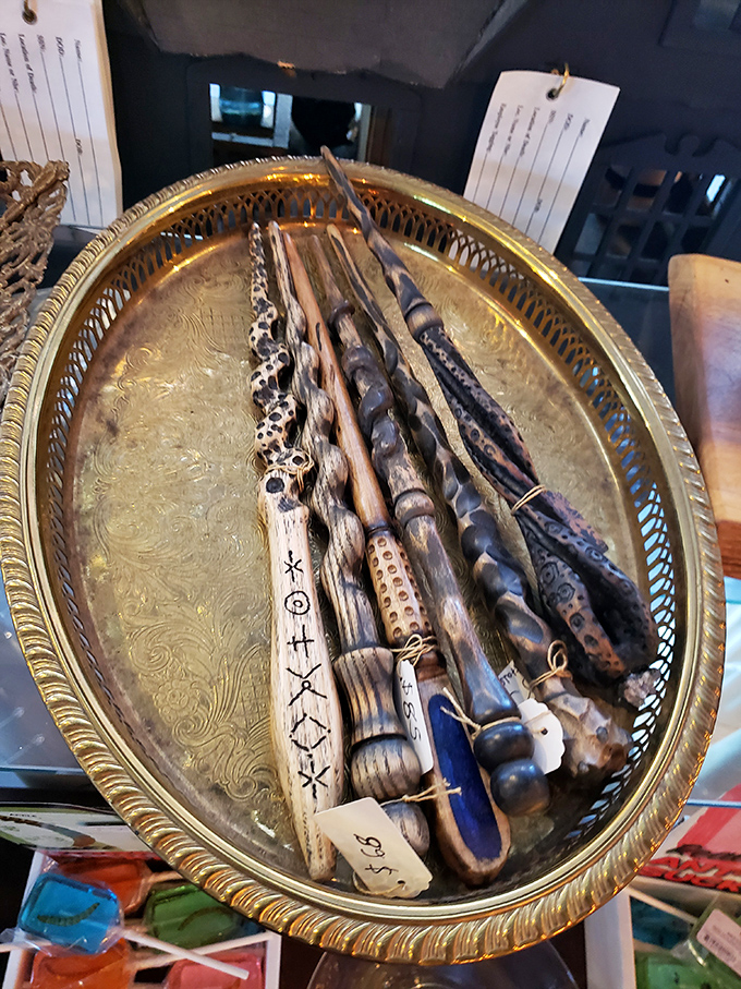 These aren't just sticks—they're hand-carved wands displayed with the reverence of ancient artifacts, each one unique and mysteriously appealing.