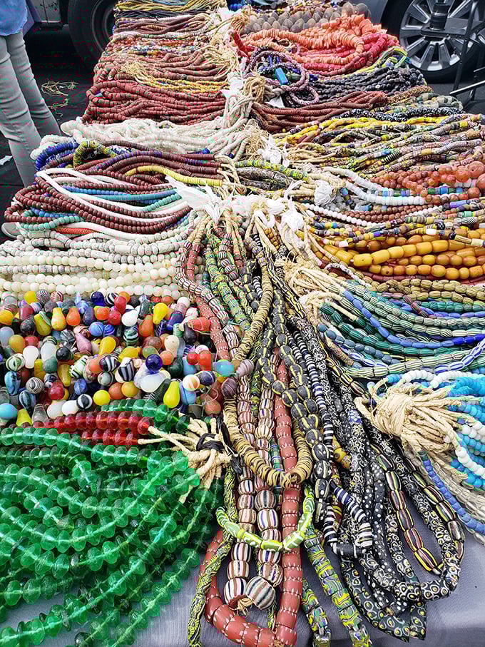 A rainbow explosion of beaded necklaces &ndash; wearable art that transforms a plain white tee into a statement of global sophistication.