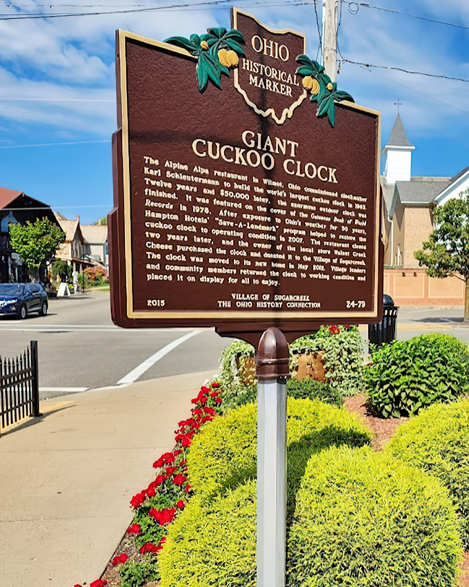The historical marker tells the clock's official story, though it sadly omits the number of "cuckoo" jokes made by dads since its installation.