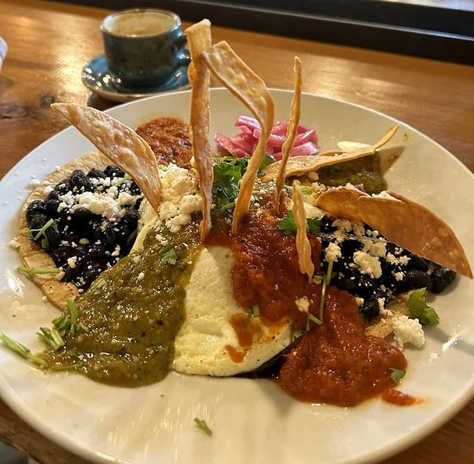 Huevos Rancheros reimagined as edible art&mdash;a symphony of sauces, textures, and flavors that dance across the plate.