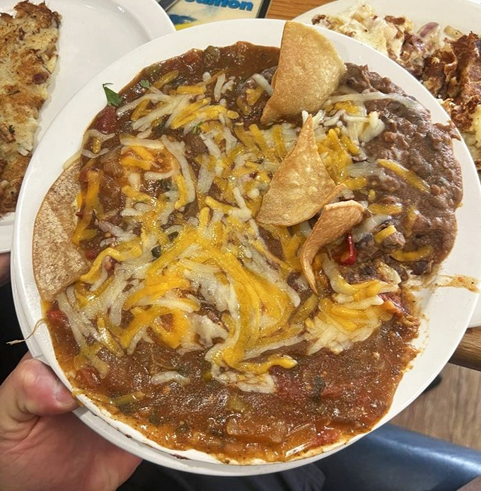 Huevos rancheros that bring the fiesta to your morning. That melted cheese pull is what breakfast dreams are made of.