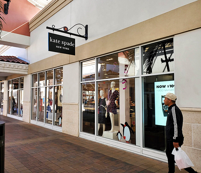 Kate Spade's colorful window displays pop against neutral architecture, like confetti at a very sophisticated party.