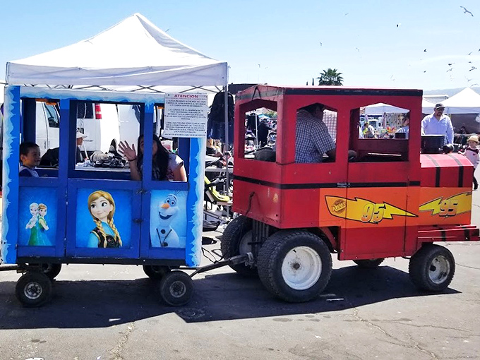All aboard the imagination express! These colorful kiddie rides prove that at the flea market, even transportation becomes an adventure.