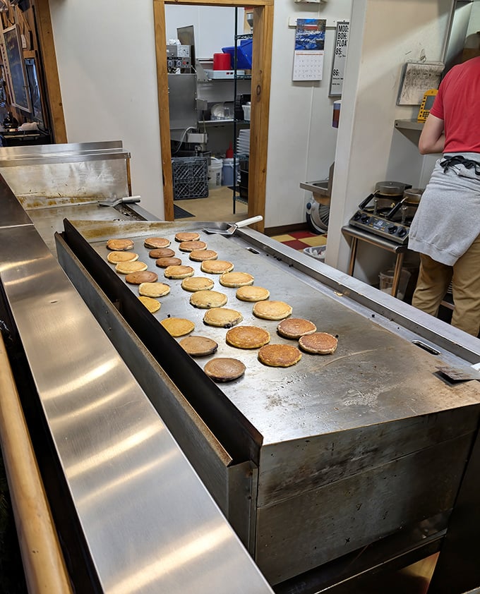 The griddle ballet in action &ndash; where pancakes get their golden tan better than most Florida retirees.