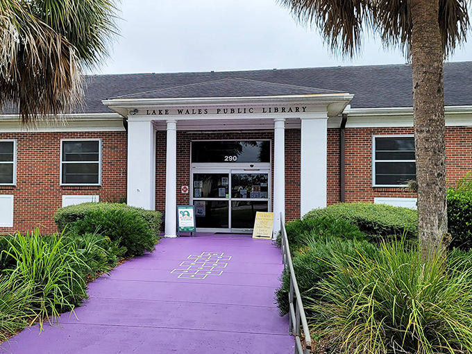 Lake Wales Public Library's purple pathway practically shouts "reading is an adventure!" A community hub where knowledge and air conditioning are equally appreciated.
