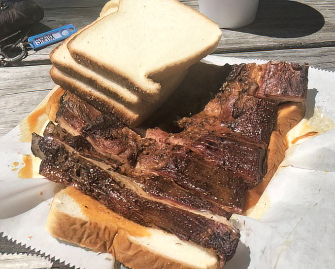 That stack of white bread isn't decoration &ndash; it's essential equipment for sopping up every last drop of that magical sauce.