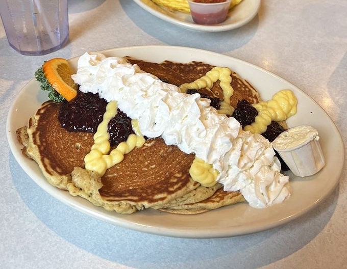 Pancakes that don't know the meaning of restraint&mdash;topped with whipped cream, fruit, and enough joy to power you through even the most Monday of Mondays.