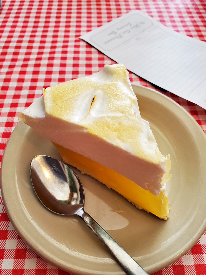 Lemon meringue pie with a cloud of meringue so perfect it looks like it's posing for its driver's license photo.