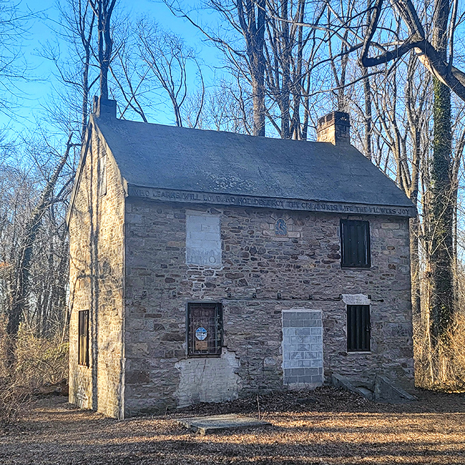 The Little Stone House stands like a humble footnote to the castle's exclamation point of architectural exuberance.