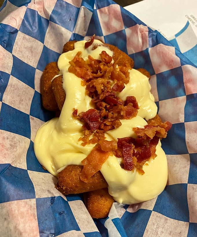 Hush puppies loaded with cheese and bacon&mdash;because sometimes the sidekick steals the show, and nobody's complaining.
