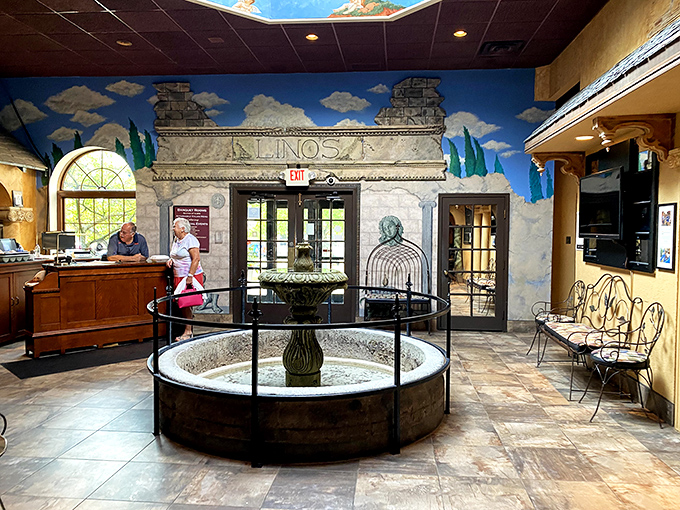 A fountain greets guests in the lobby, setting the stage for the transportive experience that awaits beyond those doors.