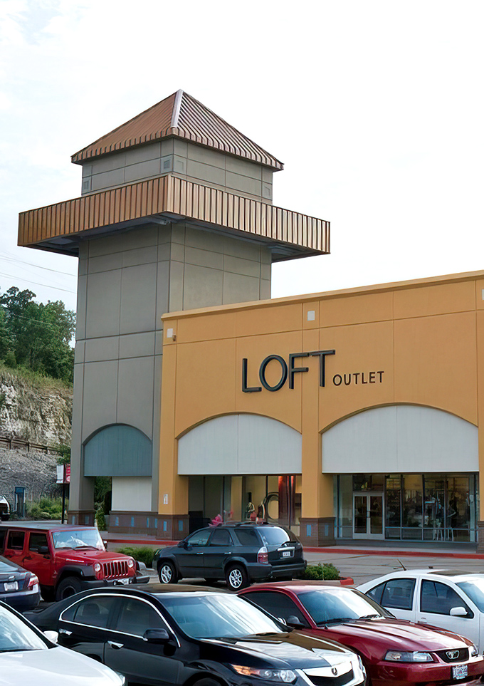 The LOFT Outlet's distinctive tower stands like a retail lighthouse, guiding fashion-forward shoppers safely to the shores of affordable style.