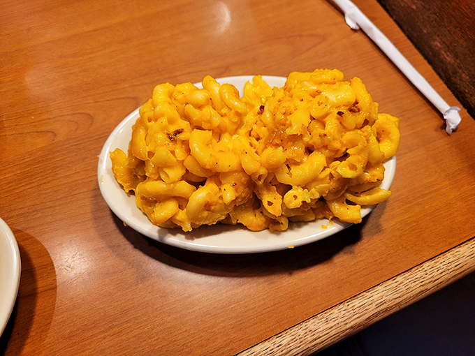 Mac and cheese that doesn't just comfort&mdash;it embraces. This isn't a side dish; it's the supporting actor that steals every scene.