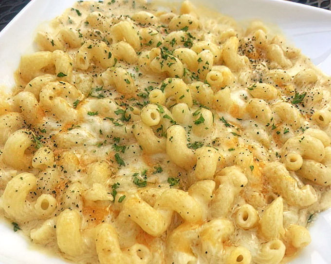 Mac and cheese elevated from childhood memory to grown-up indulgence &ndash; comfort food that's dressed for a night on the town.