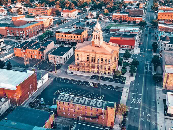 As sunset bathes Marion in golden light, the aerial view reveals a perfectly proportioned small city where everything you need is just minutes away.