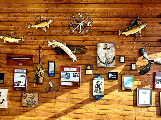 A gallery of mounted fish, nautical wheels, and maritime artifacts tells stories of Lake Erie's bounty and the region's fishing heritage.