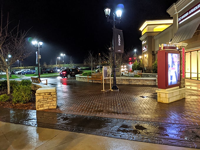 Even after sunset, the hunt for deals continues under the warm glow of Charlotte Premium Outlets' evening lighting.